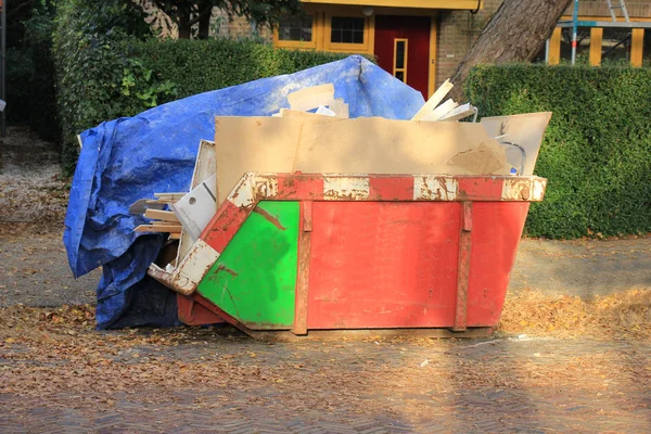 Loaded garbage dumpster ⬇ Stock Photo, Image by © portosabbia #183933916