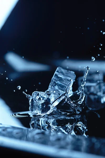 Ice cubes with water splash Stock Photo by ©strelok 100596242