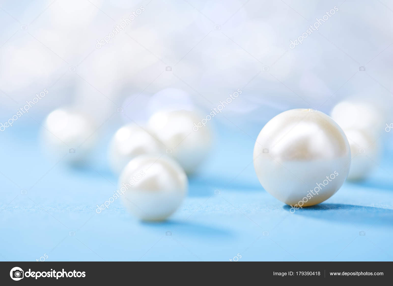 Beautiful Rare Pearls Blue Background Stock Photo by ©strelok 179390418