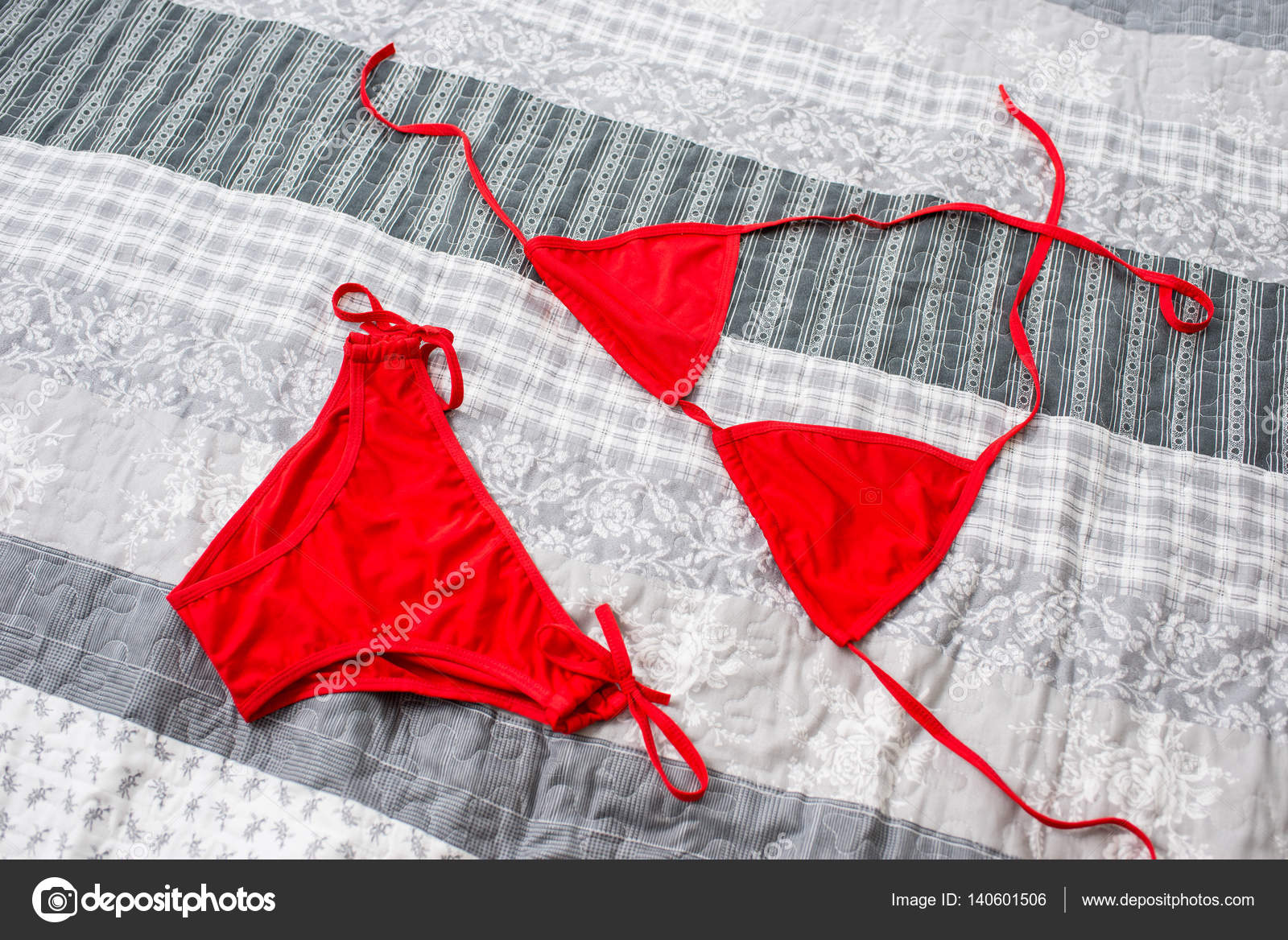 Red bikini on the bed — Stock Photo © gorbelabda #140601506