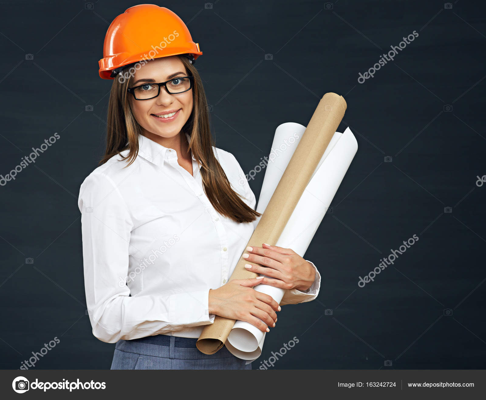 Woman architect holding blueprint — Stock Photo © sheftsoff #163242724