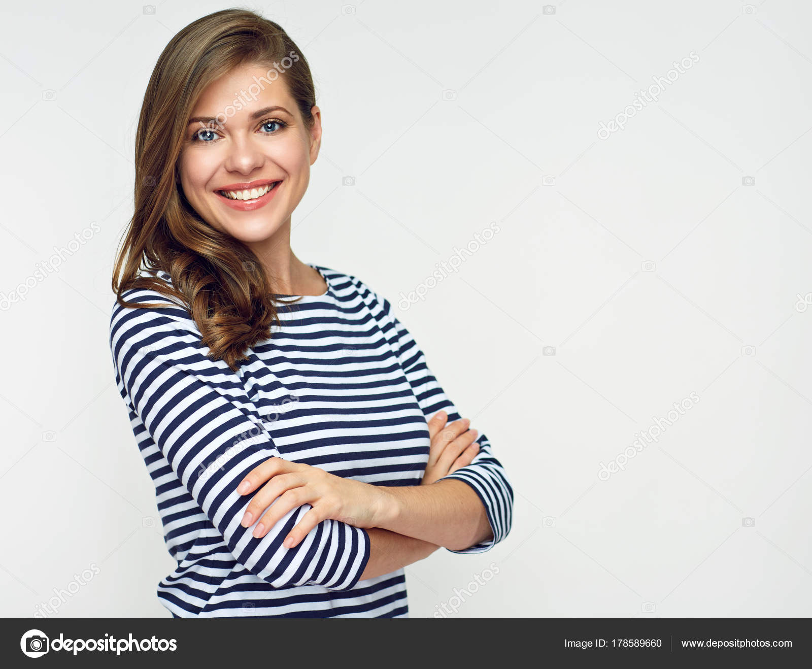 Smiling confident woman standing with crossed arms. Stock Photo by ... Smiling confident woman standing with crossed arms. Stock Photo by ...