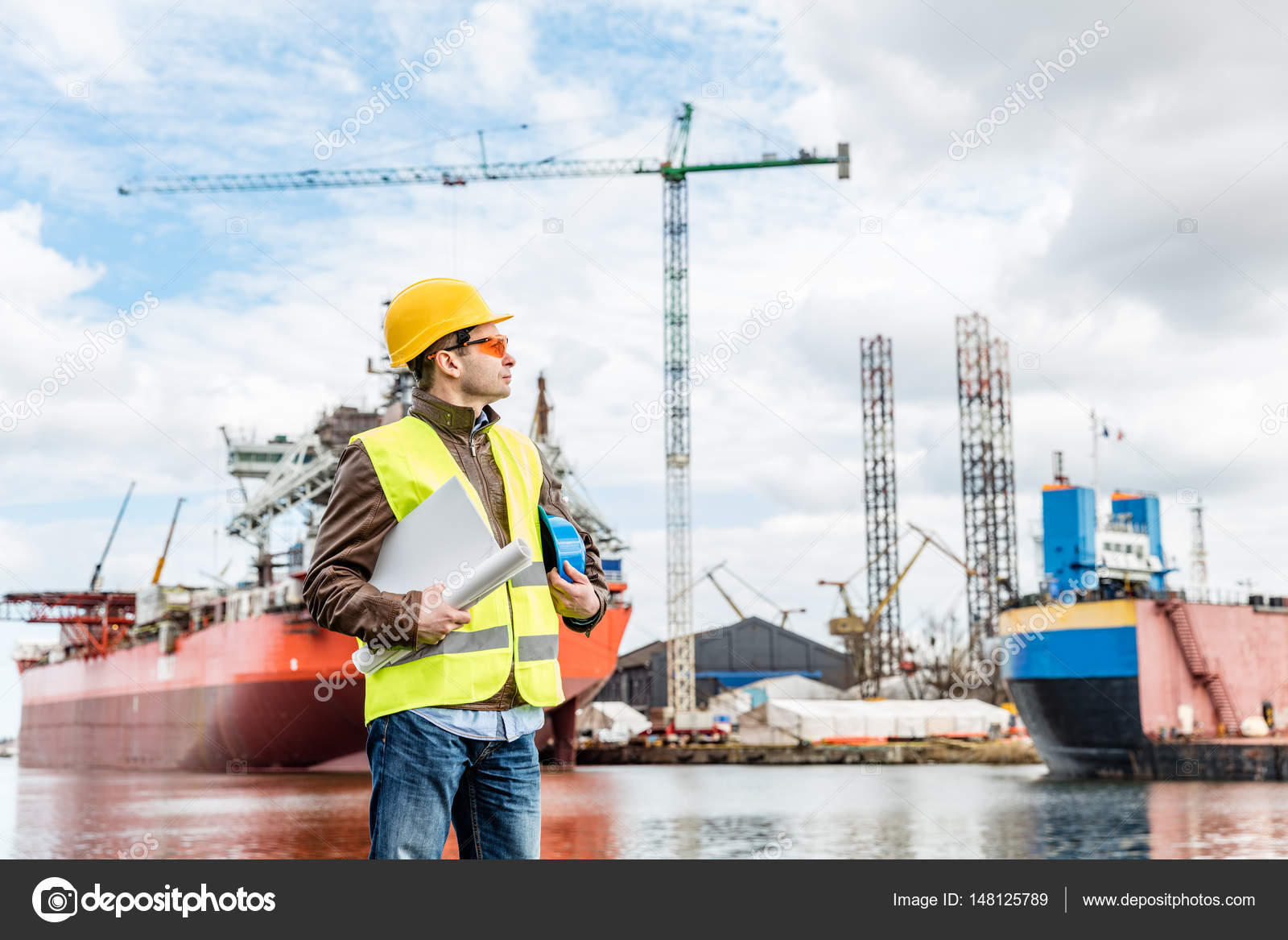 Shipbuilding engineer standing at dockside — Stock Photo © Photocreo ...