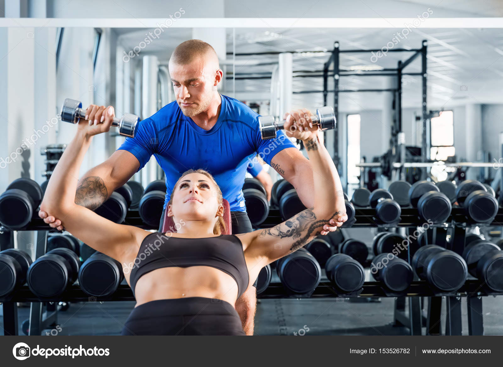 Personal trainer correcting bodybuilding at gym — Stock Photo ...