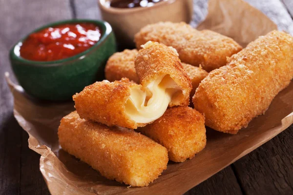 Breaded mozzarella cheese sticks — Stock Photo © igordutina #153436442