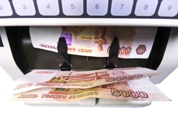electronic money counter machine is counting the Russian five ...
