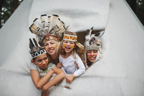 Happy children playing native american — Stock Photo © ababaka #108219186
