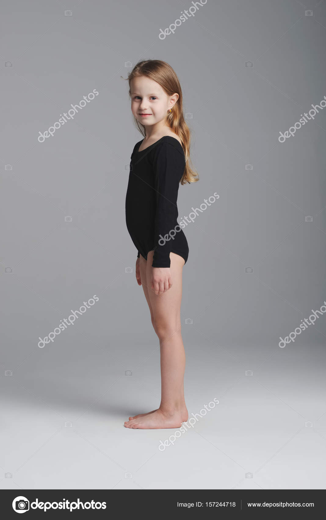 Little girl studio portrait on grey background Stock Photo by ©ababaka ...