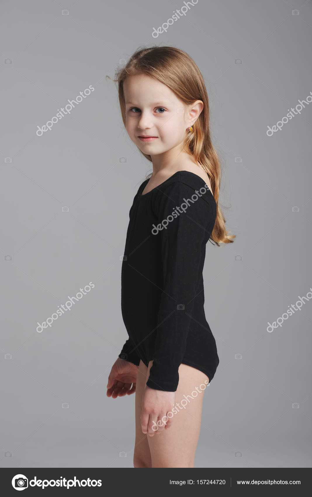 Little girl studio portrait on grey background Stock Photo by ©ababaka ...