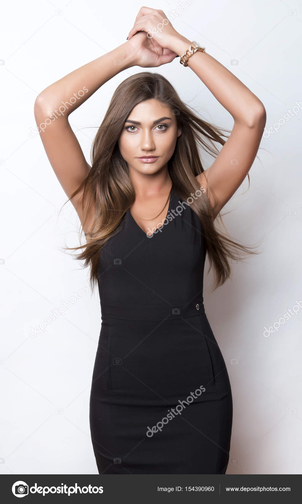 Beautiful young woman wearing wrist watch Stock Photo by ©Anetta 154390960