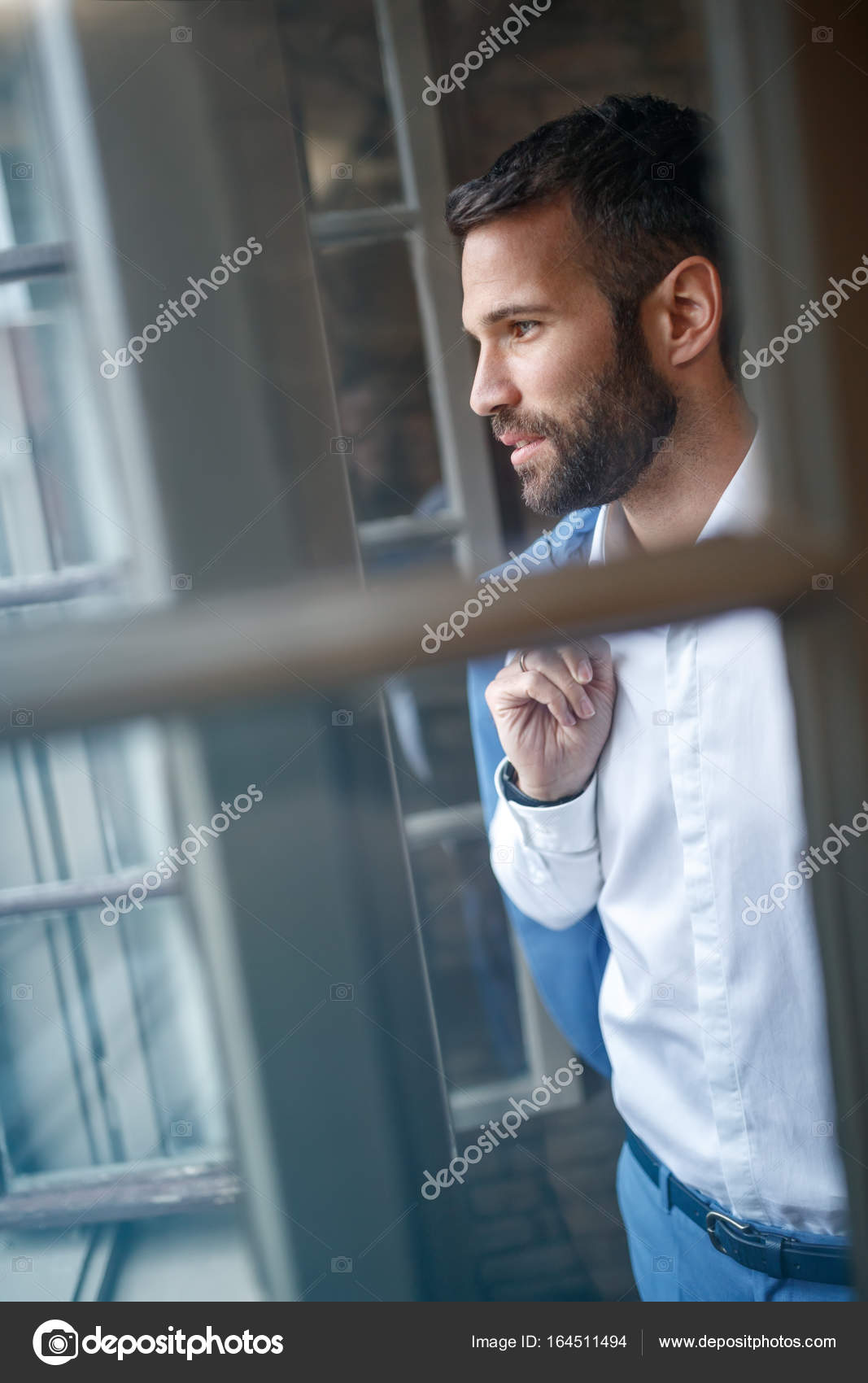 Man looking through open window Stock Photo by ©luckybusiness 164511494