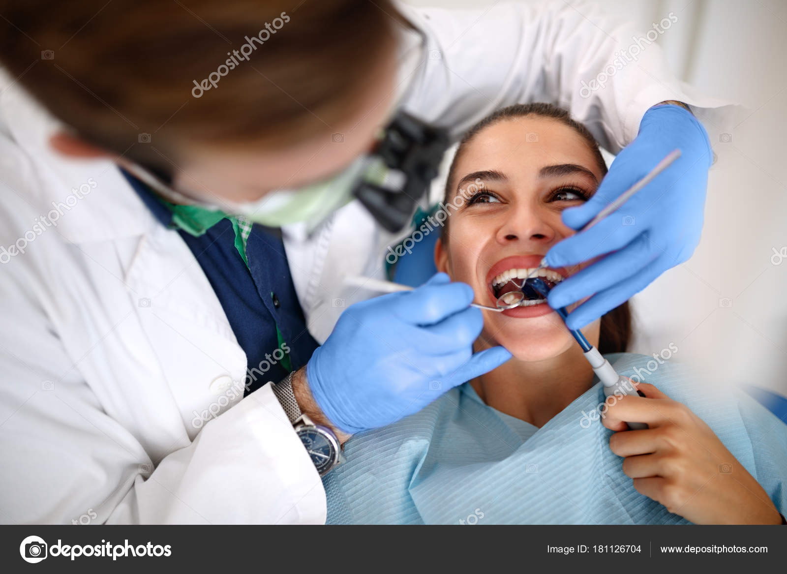 Female patient on dental check up Stock Photo by ©luckybusiness 181126704