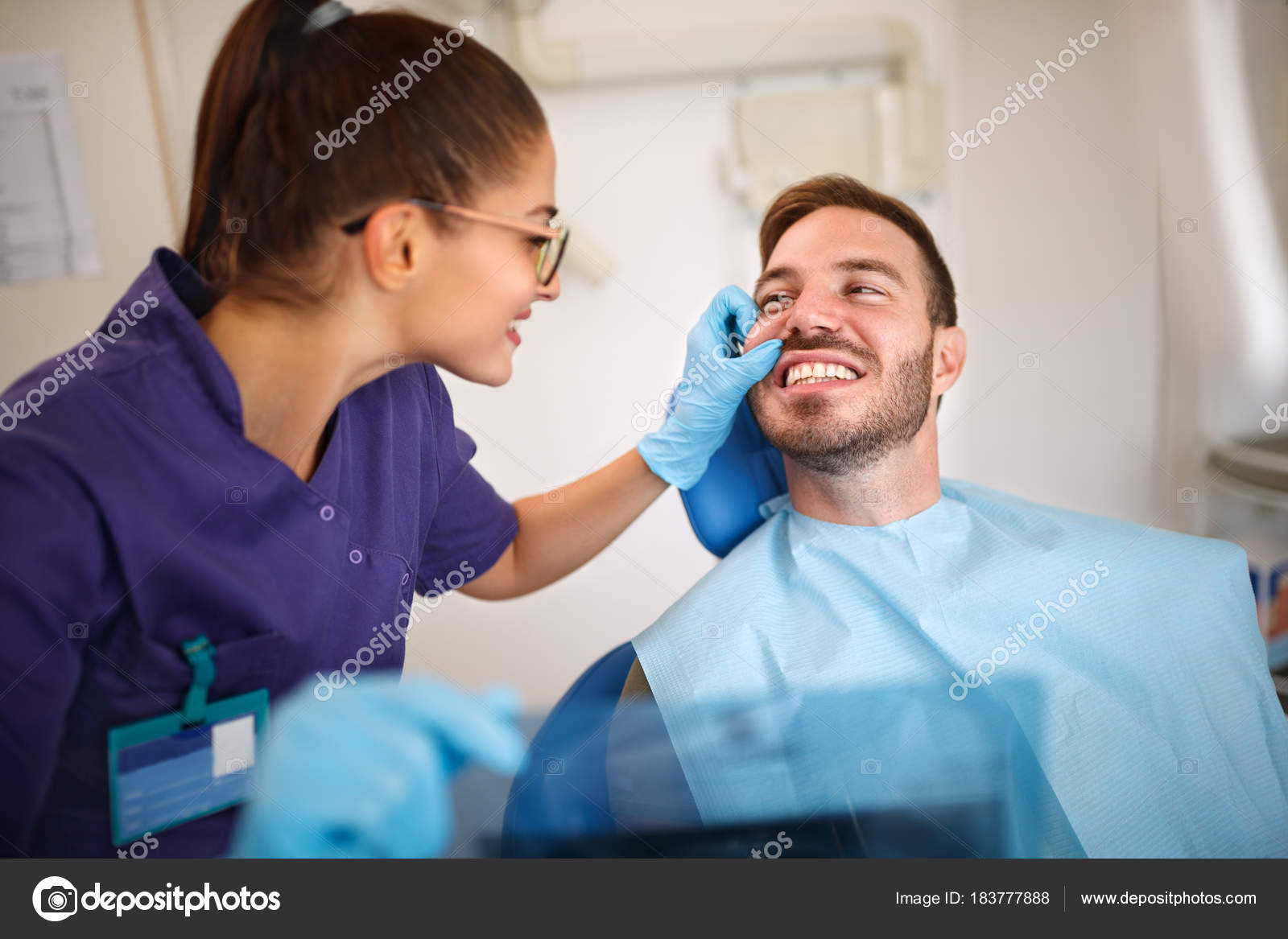 Dentist looking patient’s teeth Stock Photo by ©luckybusiness 183777888