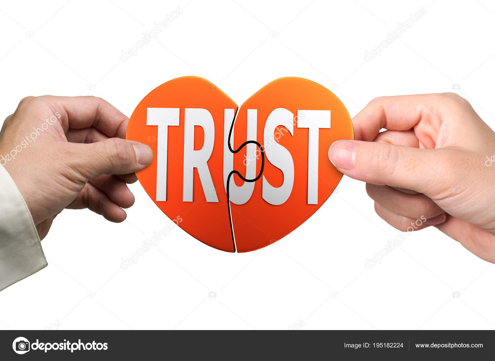 Two hands assembling heart shaped puzzle pieces with word TRUST Stock ...