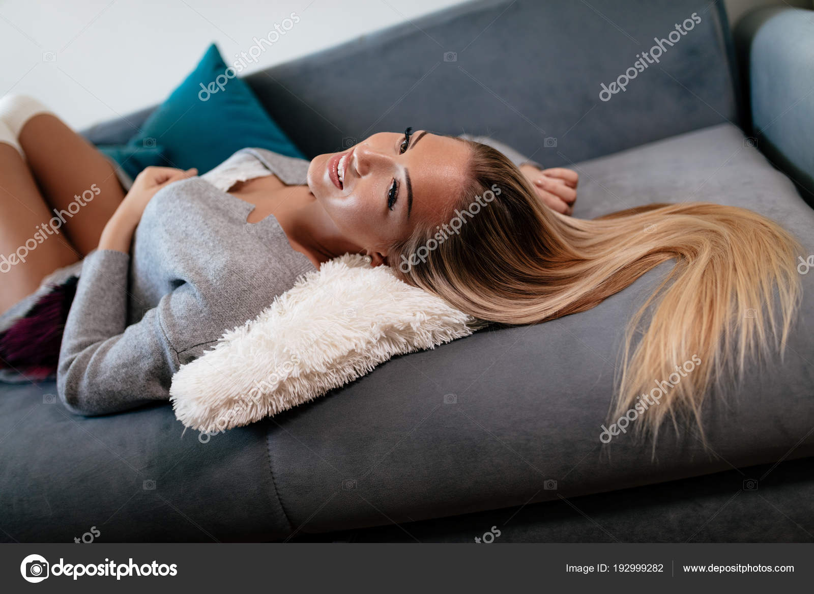 Young Smiling Woman Laying Sofa — Stock Photo © MilanMarkovic #192999282