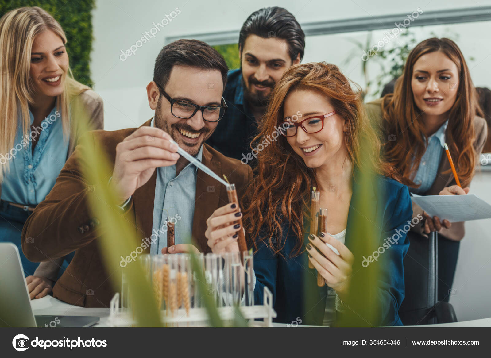 Team University Biologists Analysing Sample Plant Test Tube Watering ...