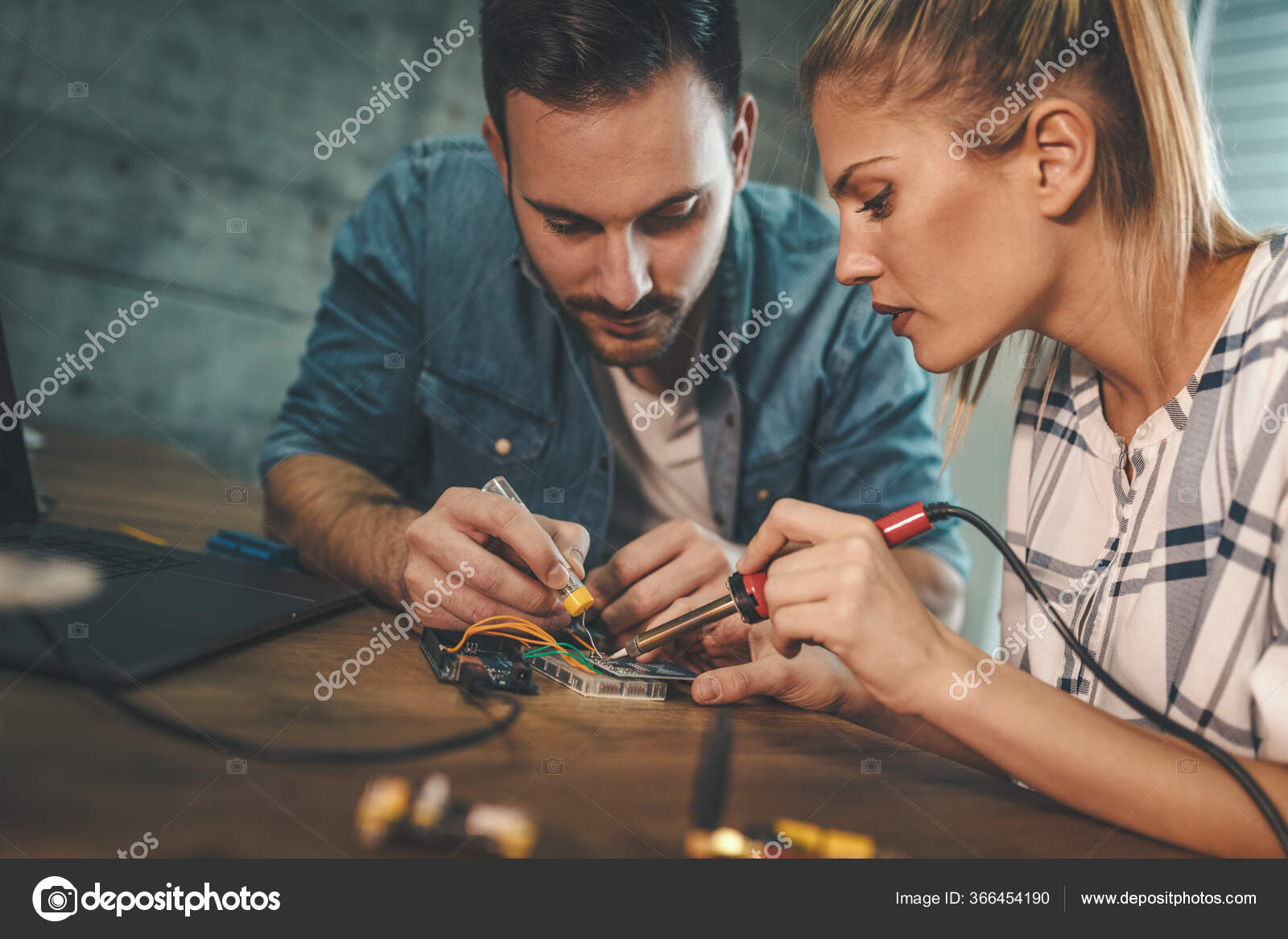 Two Young Engineers Focused Repair Electronic Equipment Soldering Iron ...