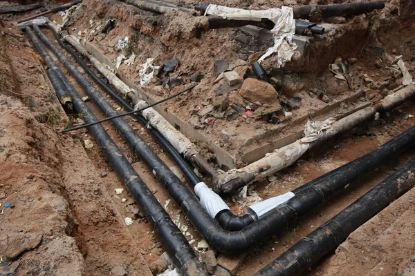 Sewer pipe in the trench — Stock Photo © Omstudio #159511428
