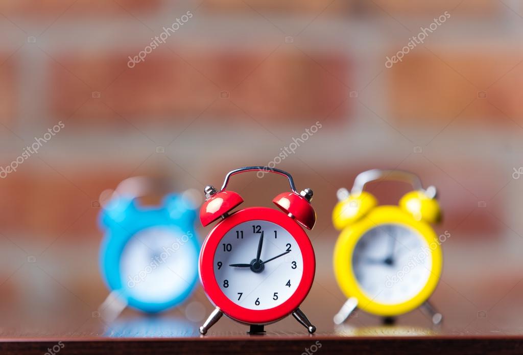 Colorful alarm clocks Stock Photo by ©massonforstock 128322428