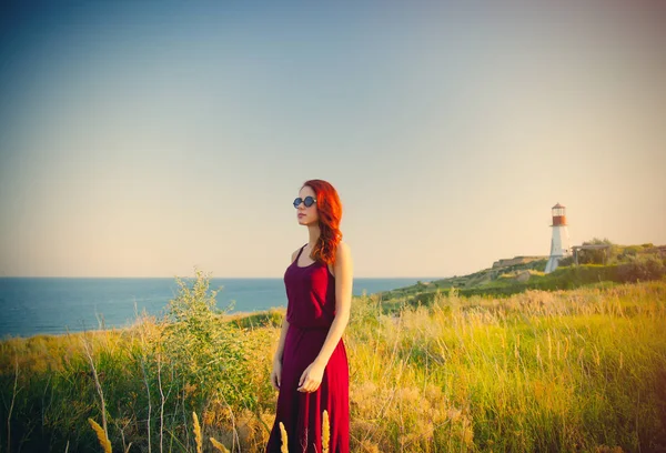 Girl by lighthouse Stock Photos, Royalty Free Girl by lighthouse Images ...