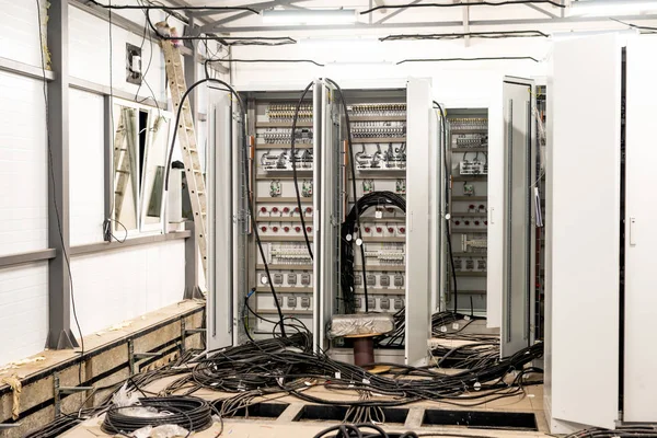 Relay hall with a variety of wires in the process of installatio Stock ...