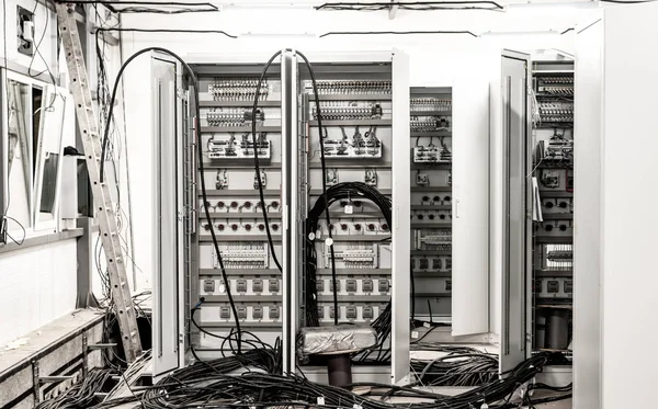 Relay hall with a variety of wires in the process of installatio Stock ...