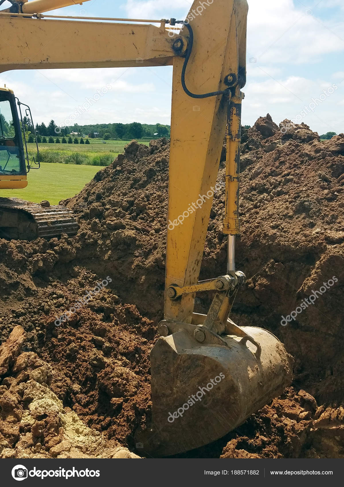 Backhoe Digging A Hole