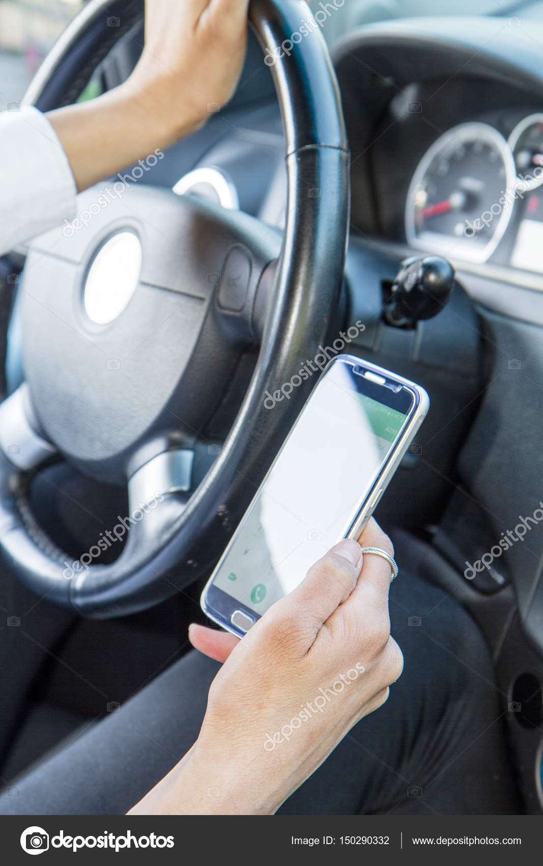 Woman in car with mobile phone Stock Photo by ©lsantilli 150290332