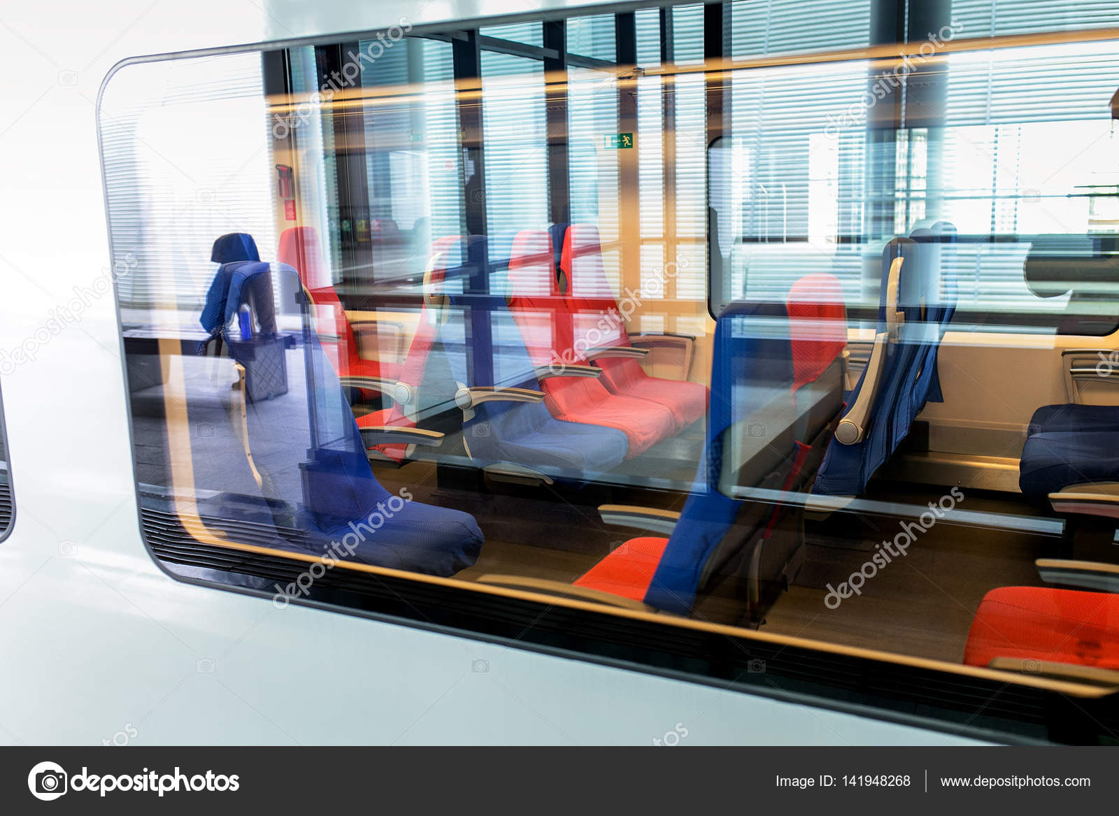 An interior view through a glass of a modern high speed train with ...
