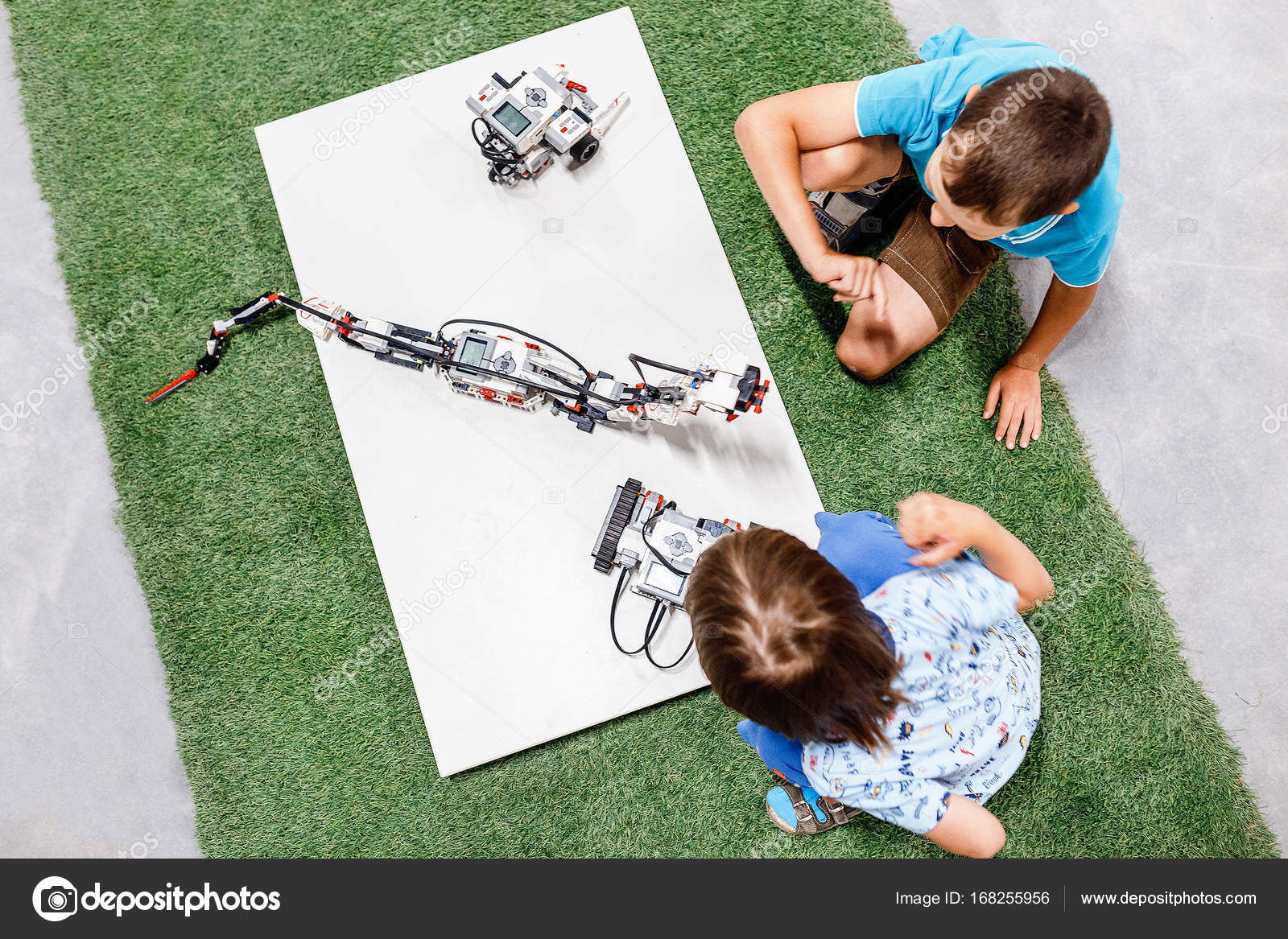 Two young boys playing with robots, educational and playing concept ...