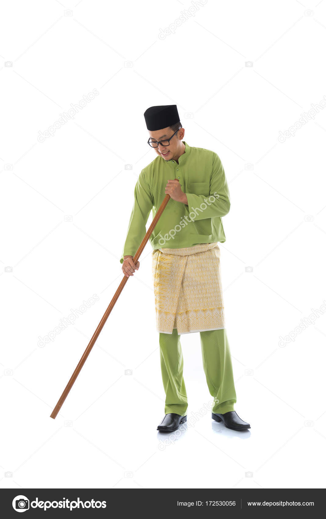 Young man holding stick Stock Photo by ©yuliang11 172530056