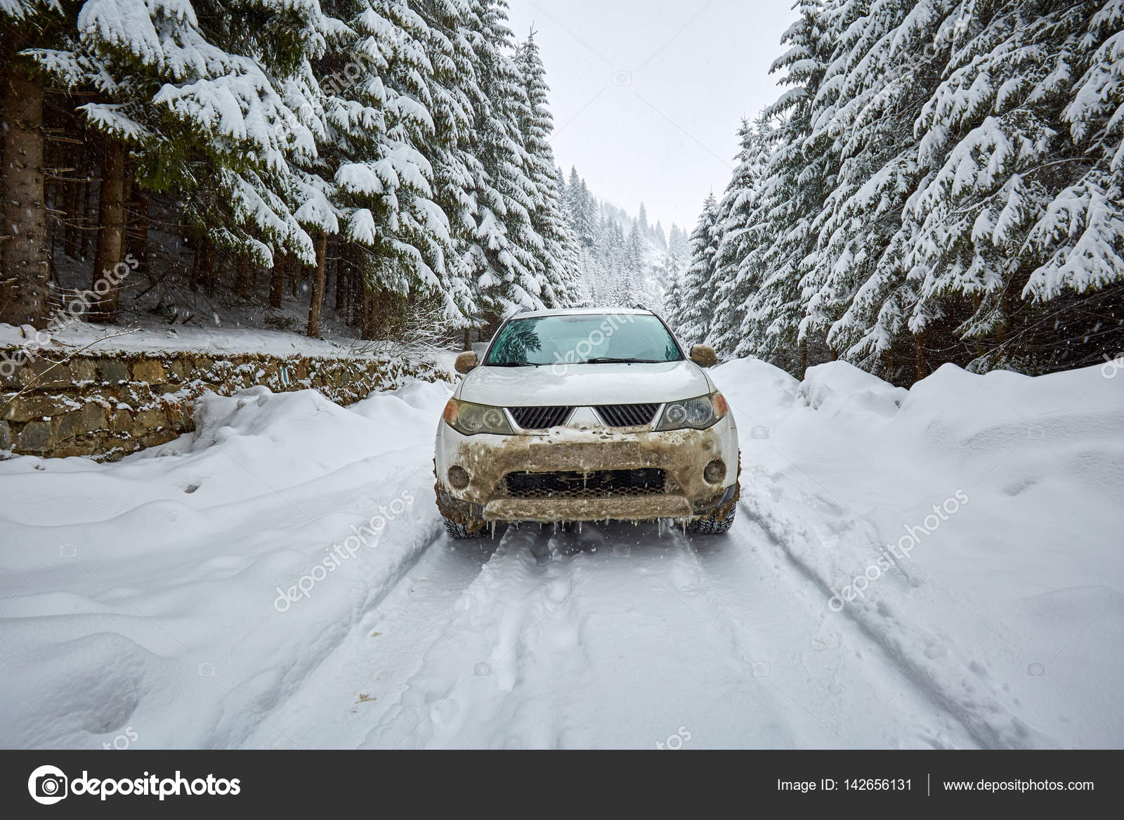 Car on a snowy road in the mountains – Stock Editorial Photo © Xalanx ...