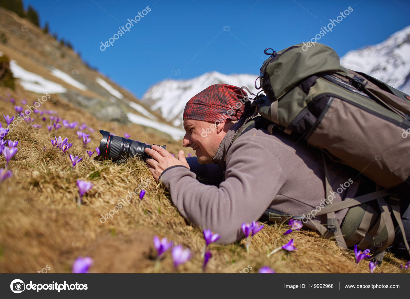 Hiker with camera taking photos — Stock Photo © Xalanx #149992968