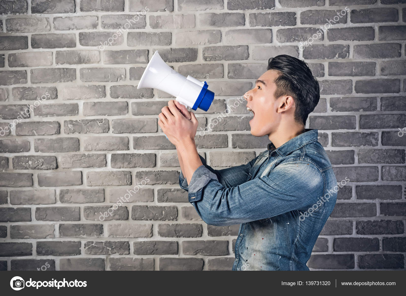 Man hold a bullhorn — Stock Photo © elwynn #139731320