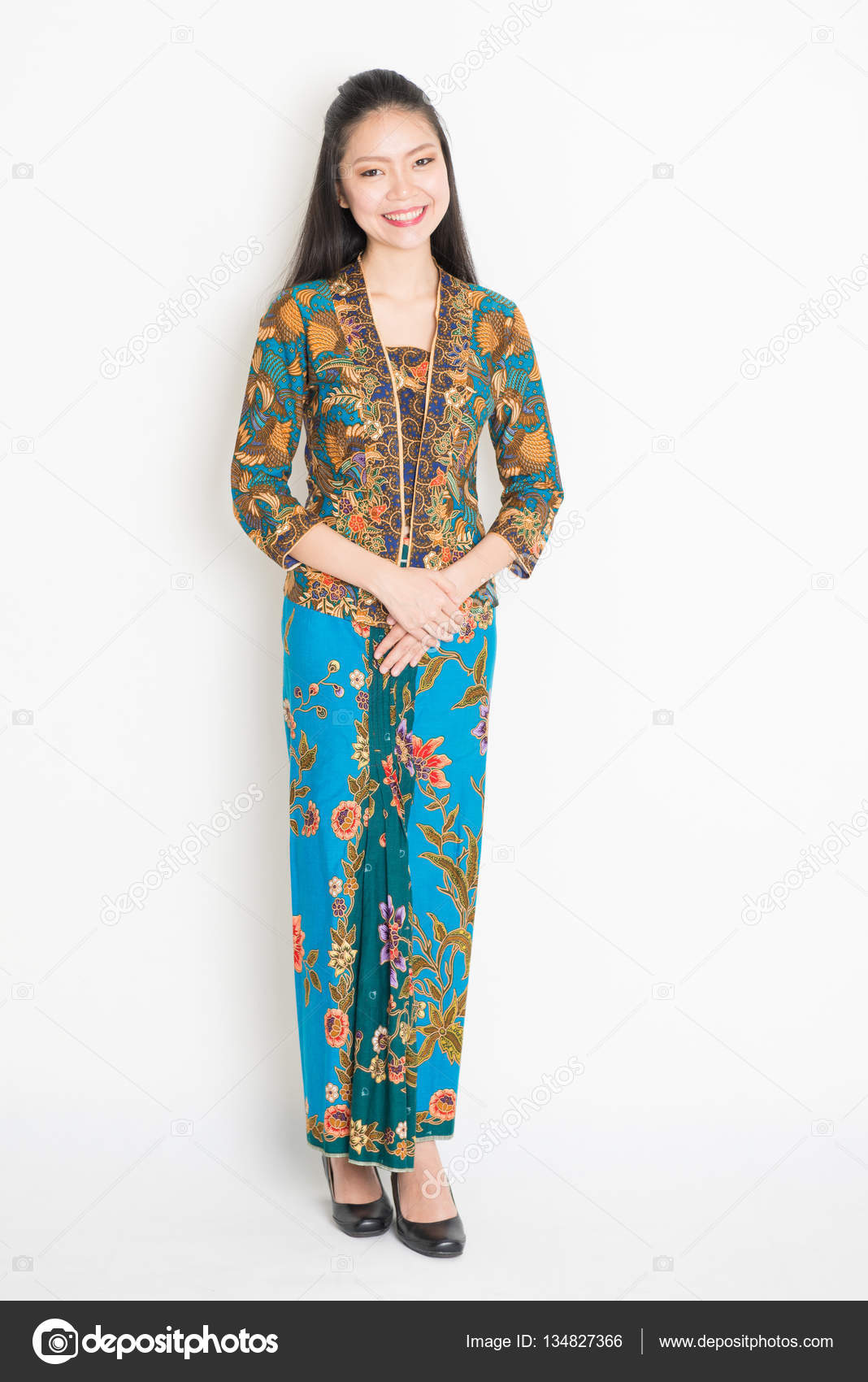 Southeast Asian female in batik dress Stock Photo by ©szefei 134827366