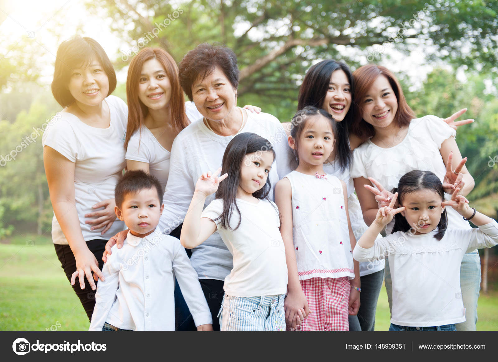 Group of Asian multi generations family outdoors — Stock Photo © szefei ...