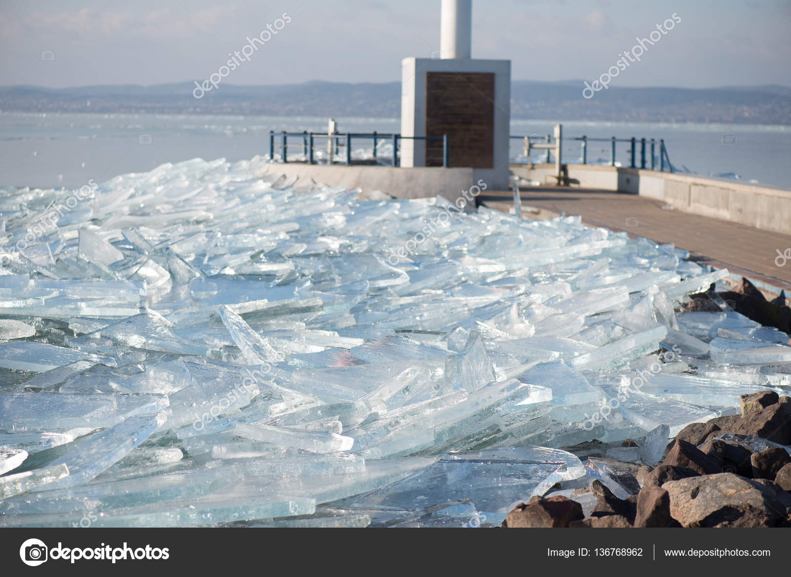 Texture of ice surface, cracked ice floating on blue water, seasonal ...