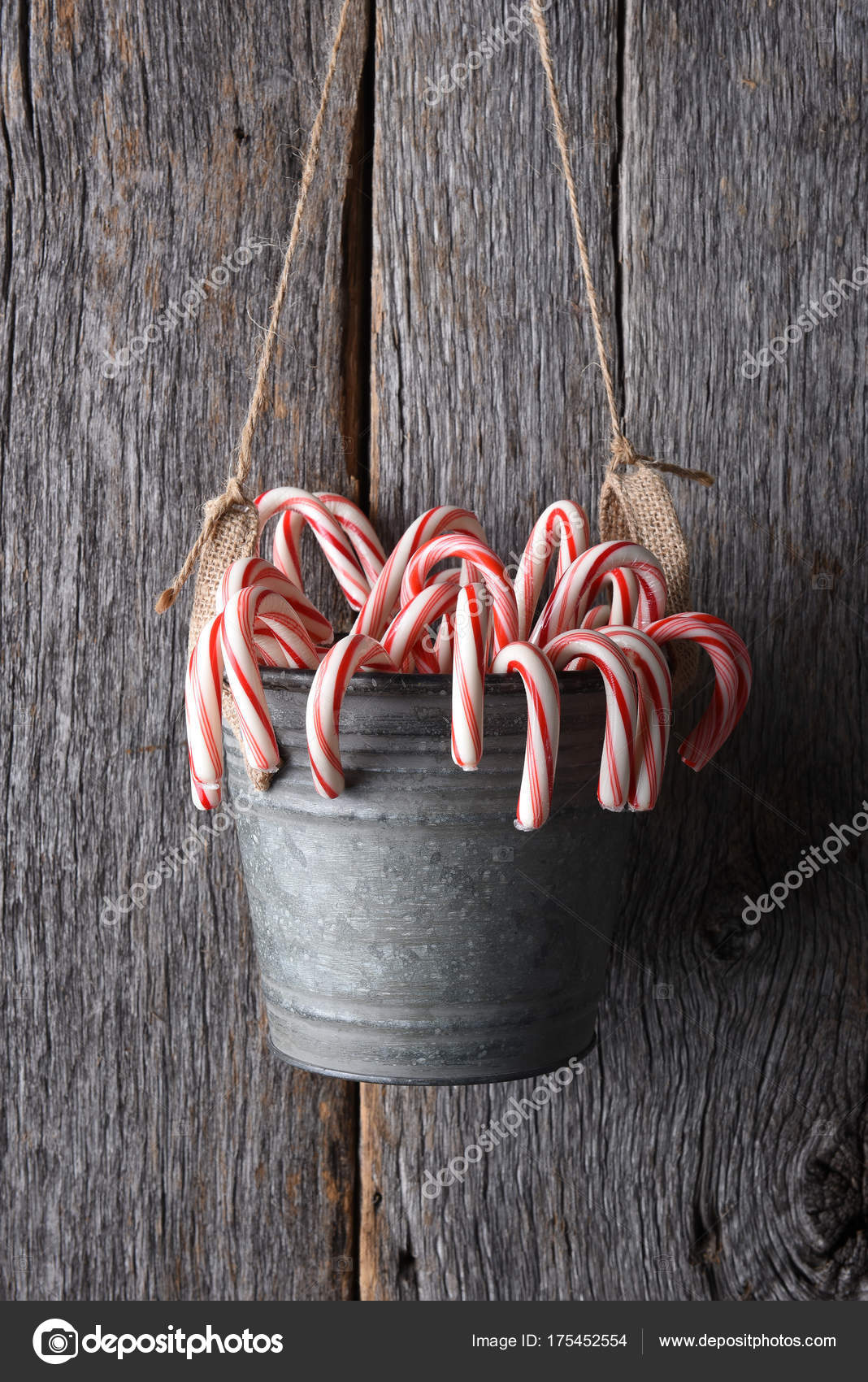 Candy Cane Bucket Hanging on Wood Wall — Stock Photo © scukrov #175452554
