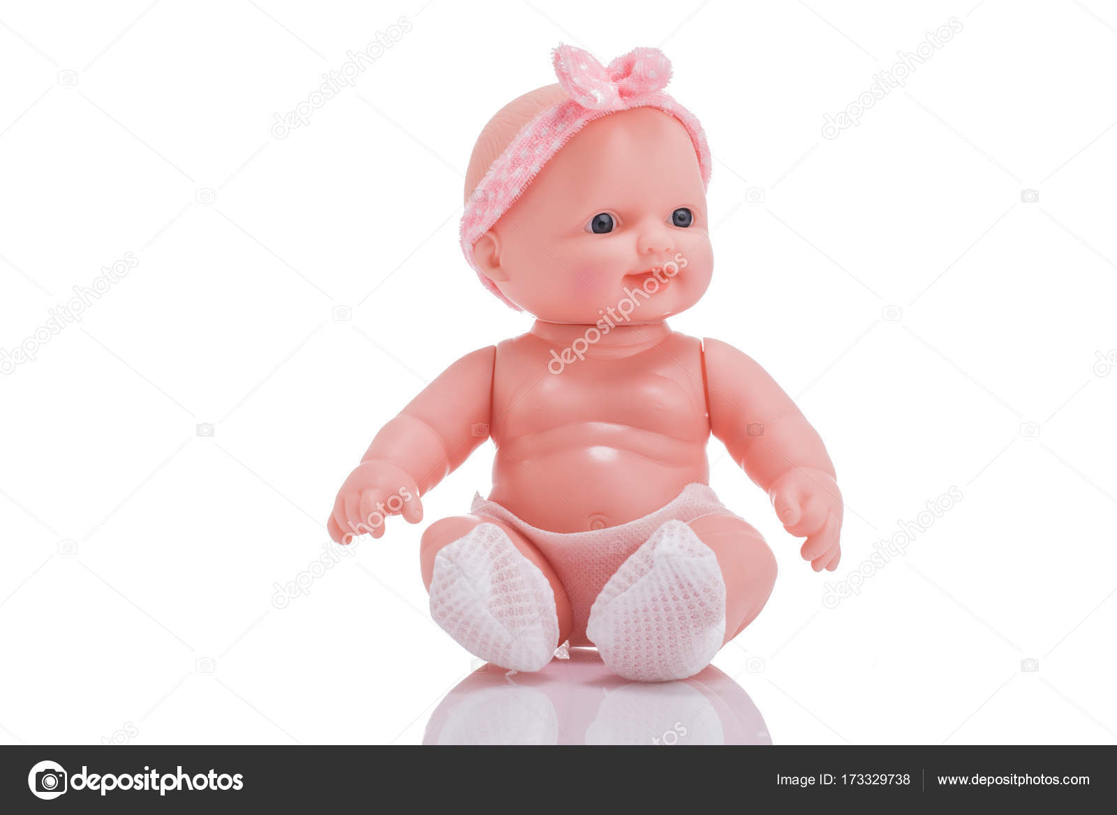 Cute little plastic baby doll with blue eyes sitting isolated o — Stock ...