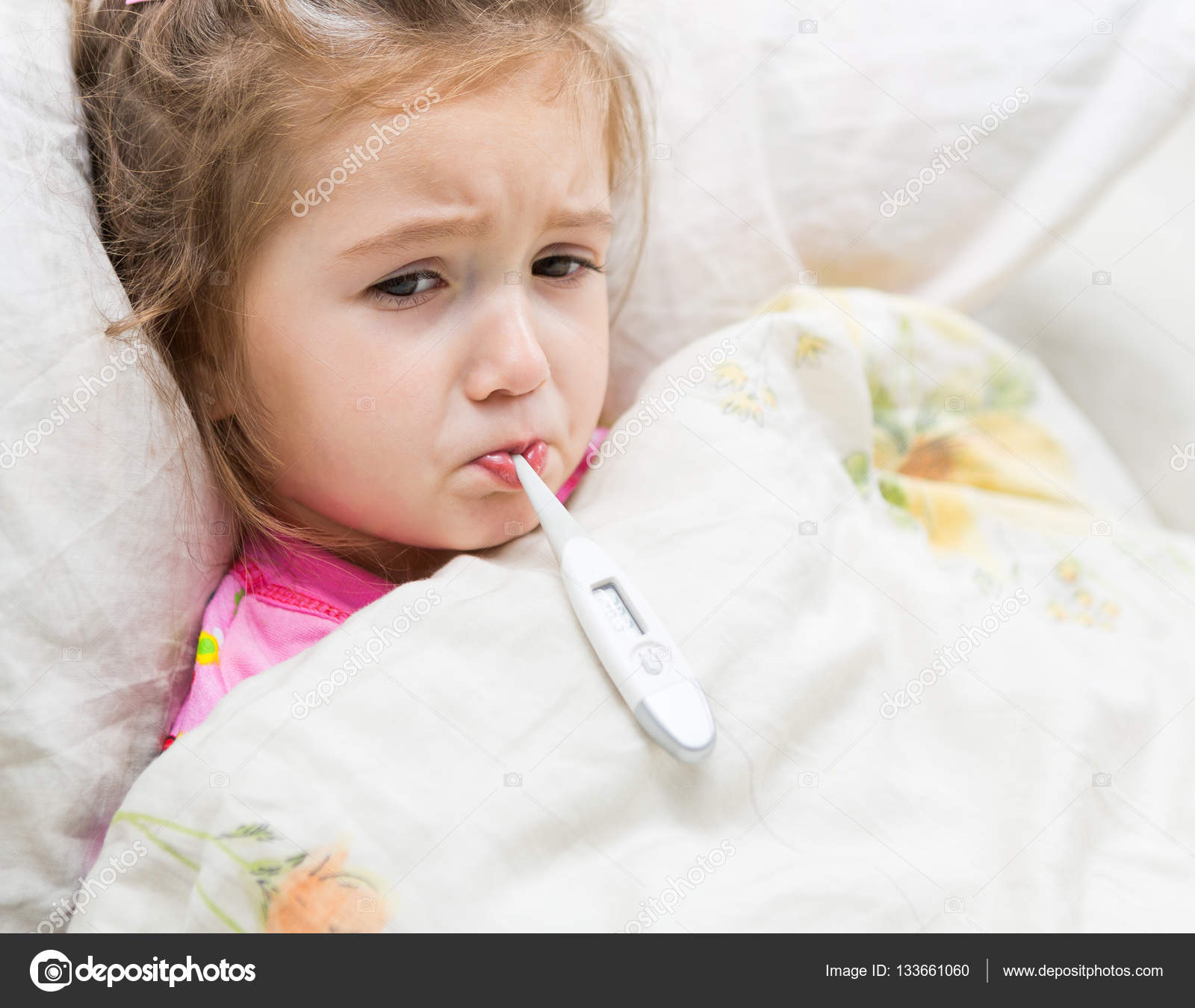 Sick little girl holding thermometer laying in bed — Stock Photo © sergchalenko #133661060