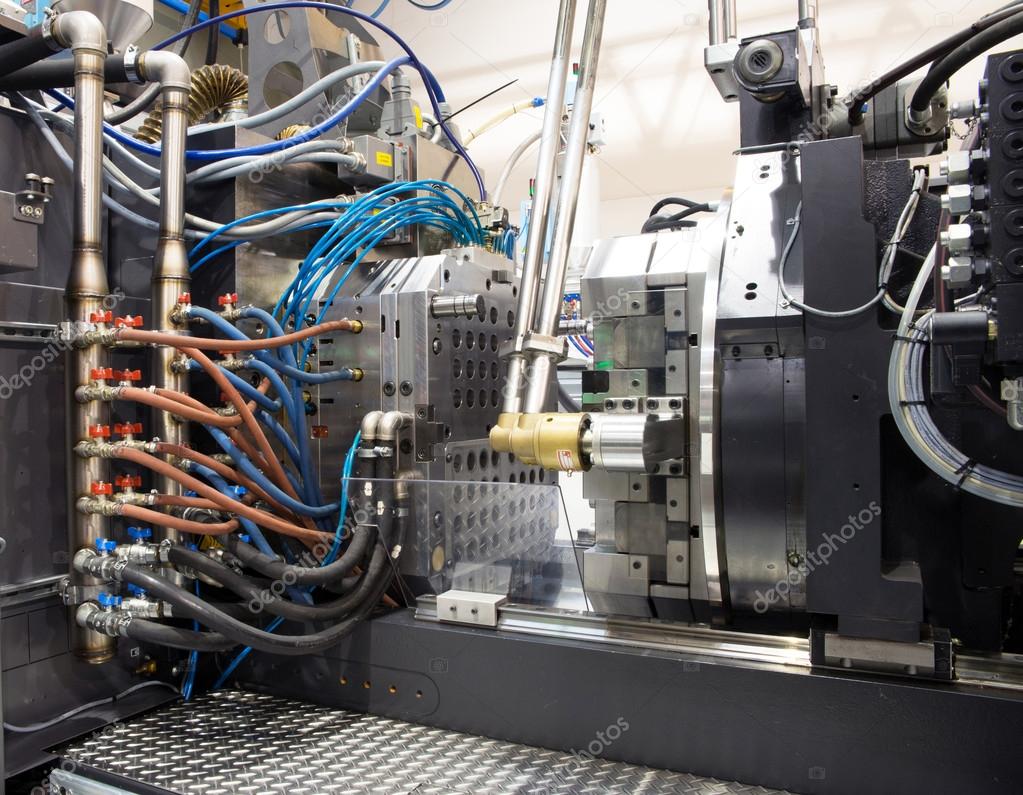 Injection molding machines in a large factory — Stock Photo © moreno ...