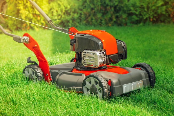 Modern petrol powered rotary push grass lawn mower - Stock Image ...