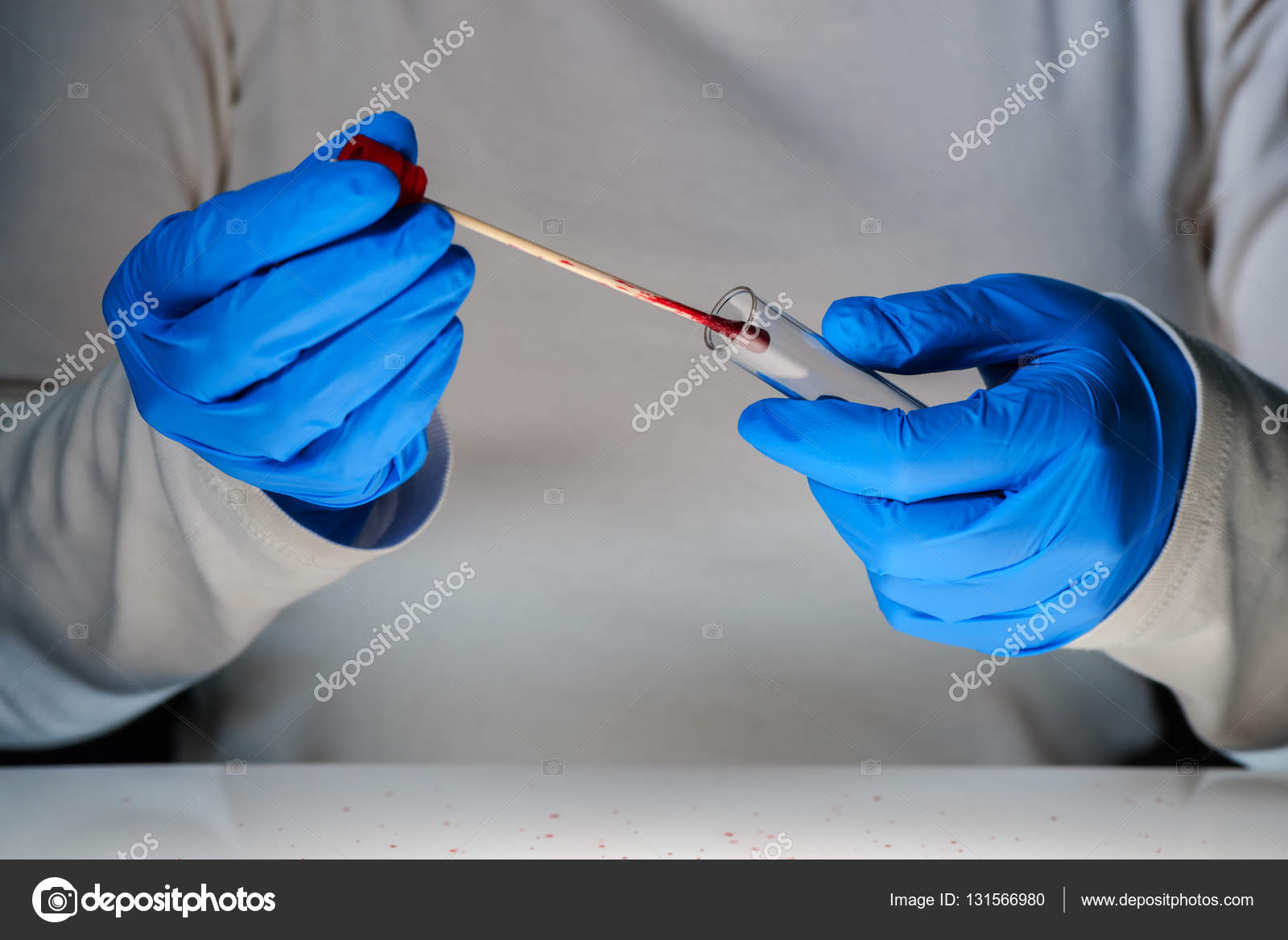 Forensic technician taking DNA sample from blood stain — Stock Photo ...
