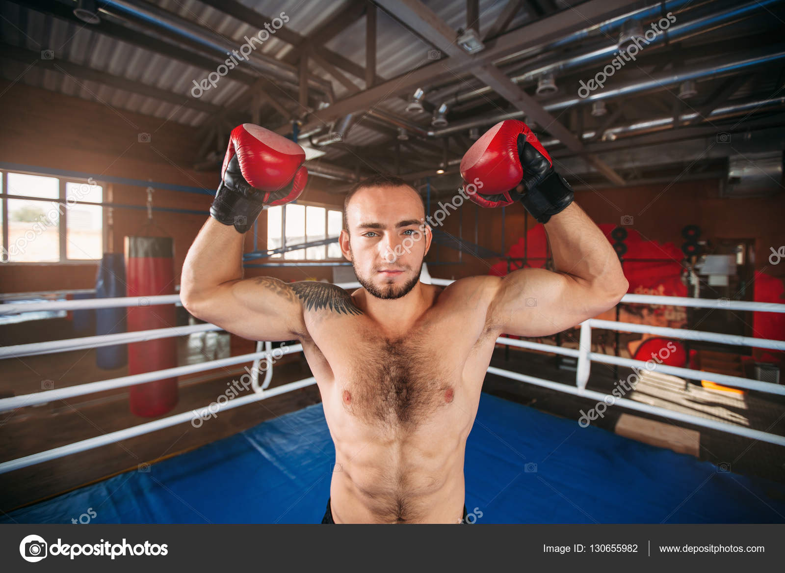 Boxer showing muscles — Stock Photo © Nomadsoul1 #130655982