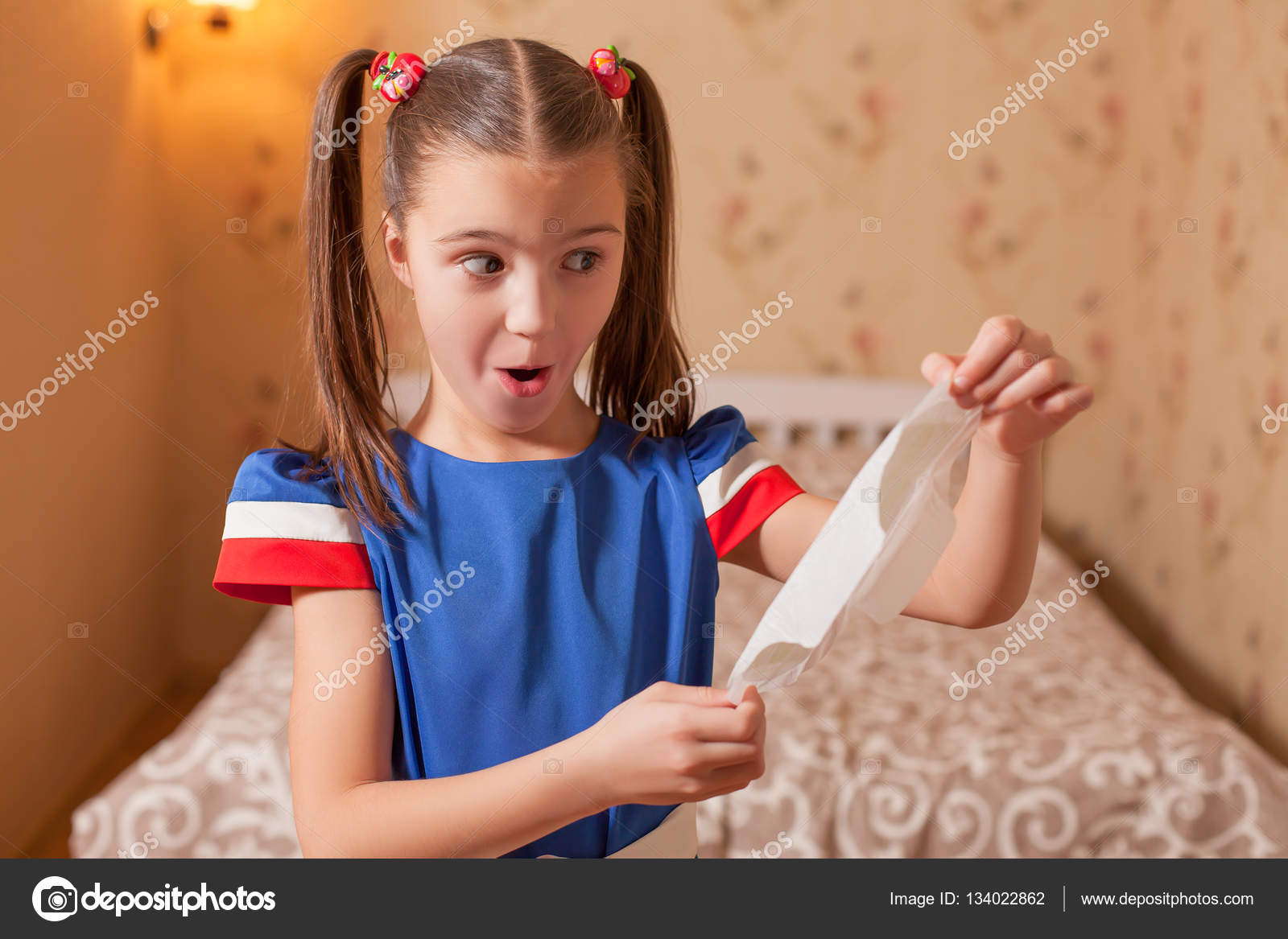 Little girl holding menstrual pad — Stock Photo © Nomadsoul1 #134022862