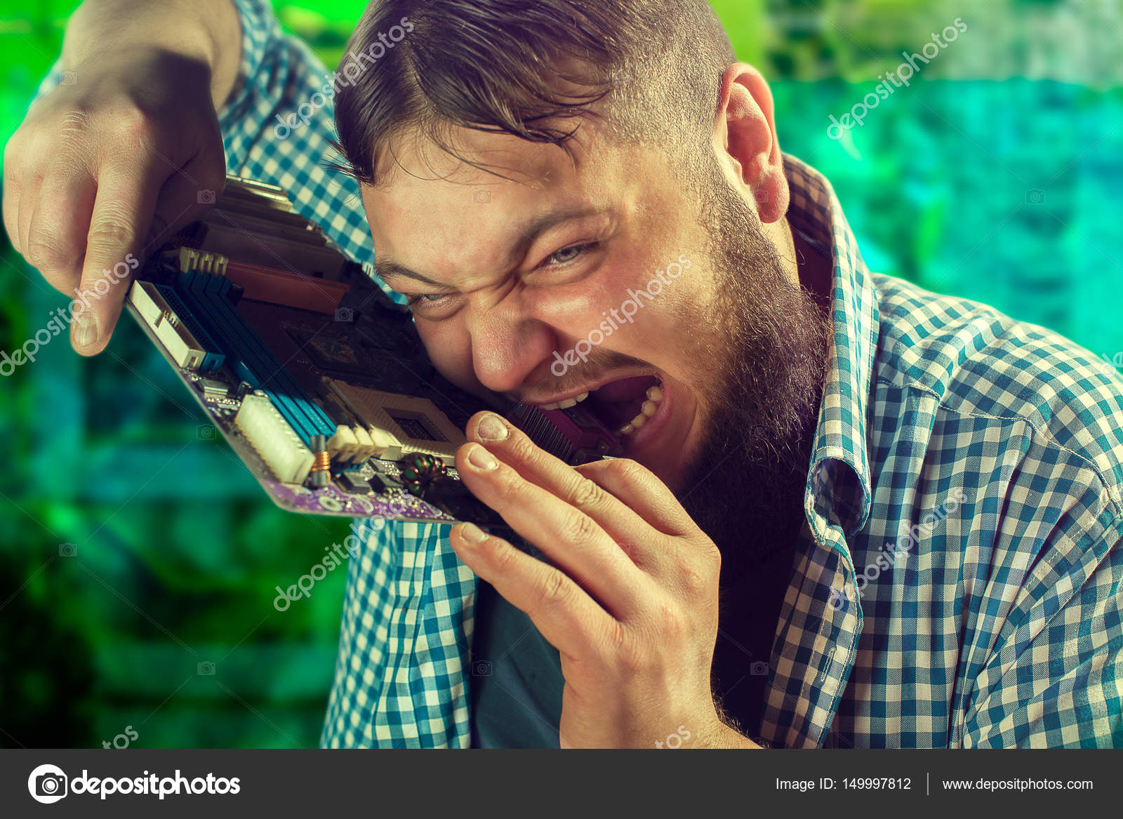 Engineer biting computer motherboard. — Stock Photo © Nomadsoul1 #149997812