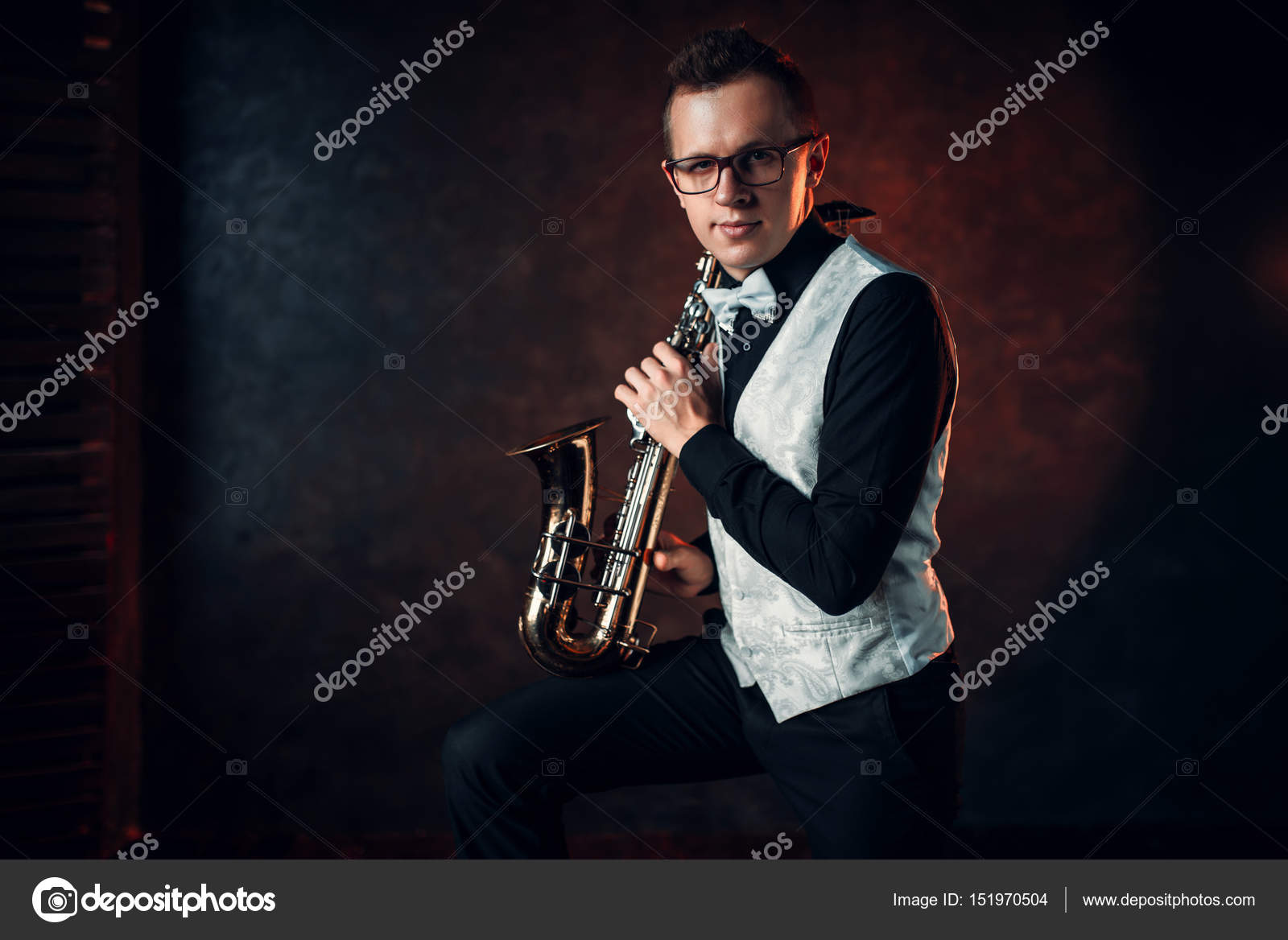 Male musician posing with saxophone — Stock Photo © Nomadsoul1 #151970504