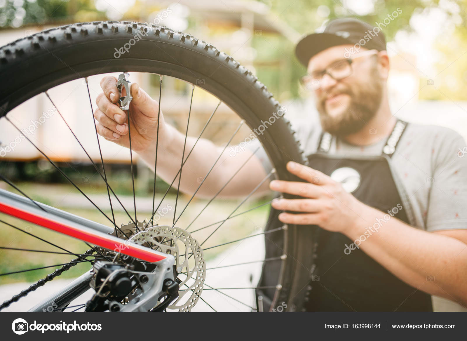 Professional bicycle mechanic Stock Photo by ©Nomadsoul1 163998144