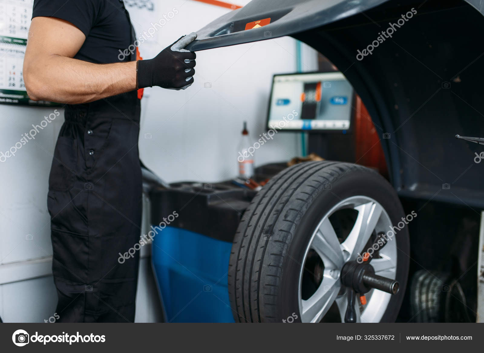 Mechanic Fixing Broken Wheel Balancing Machine Tire Service Man Repairs ...
