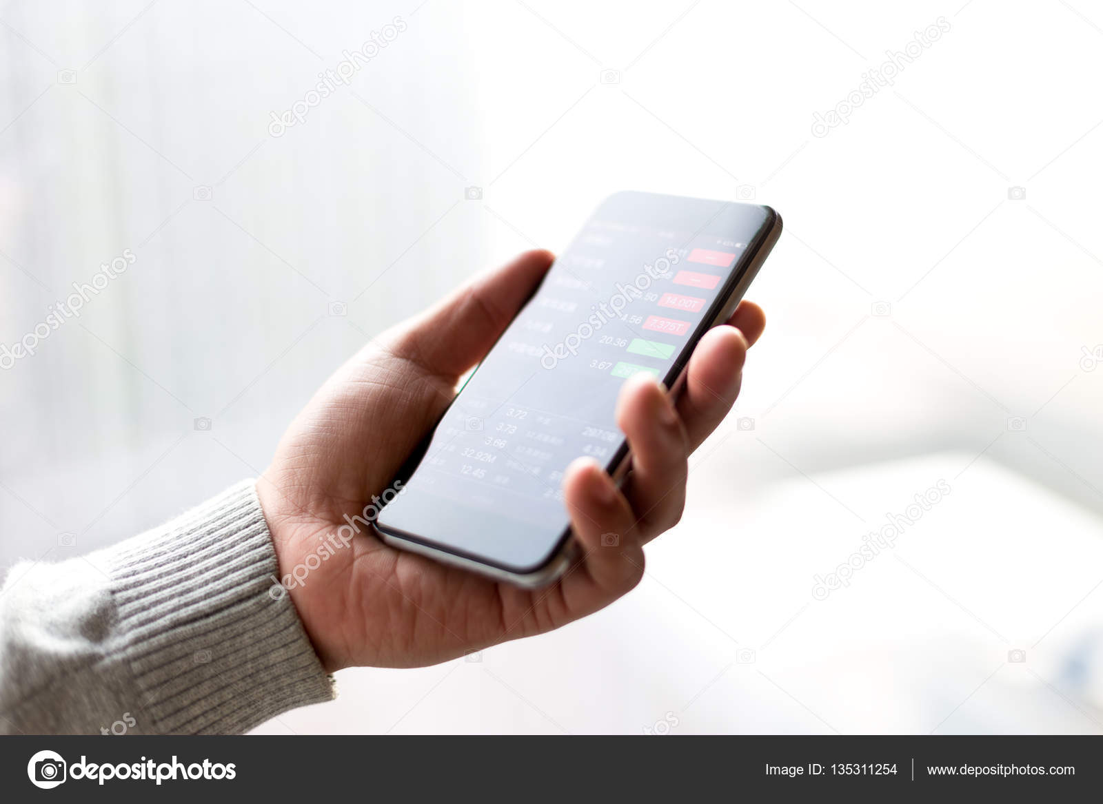 Mobile phone in man's hand Stock Photo by ©zhudifeng 135311254